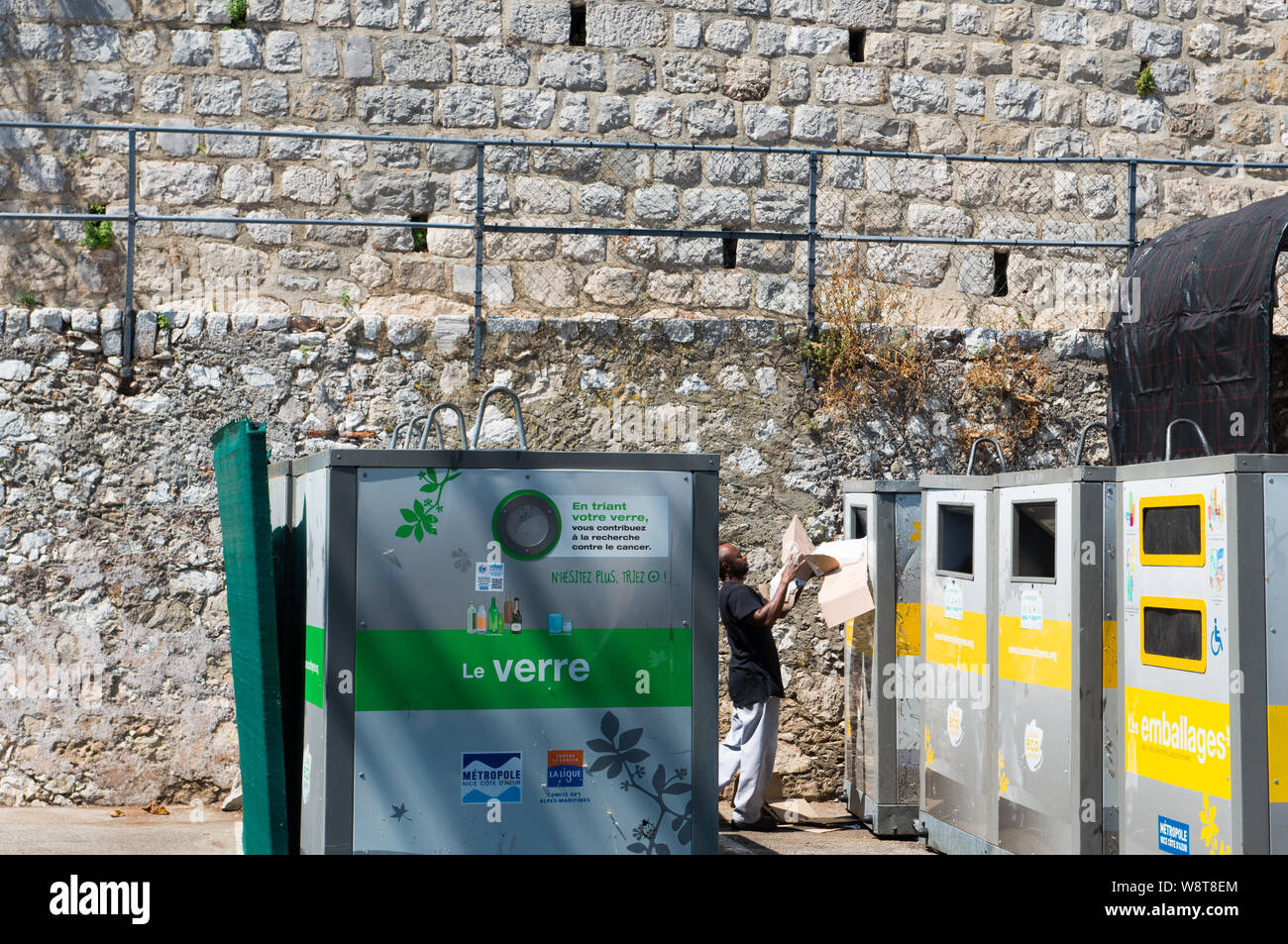 Villefranche-France,, 2019-08-03, Chef walking towards recycle bins ...