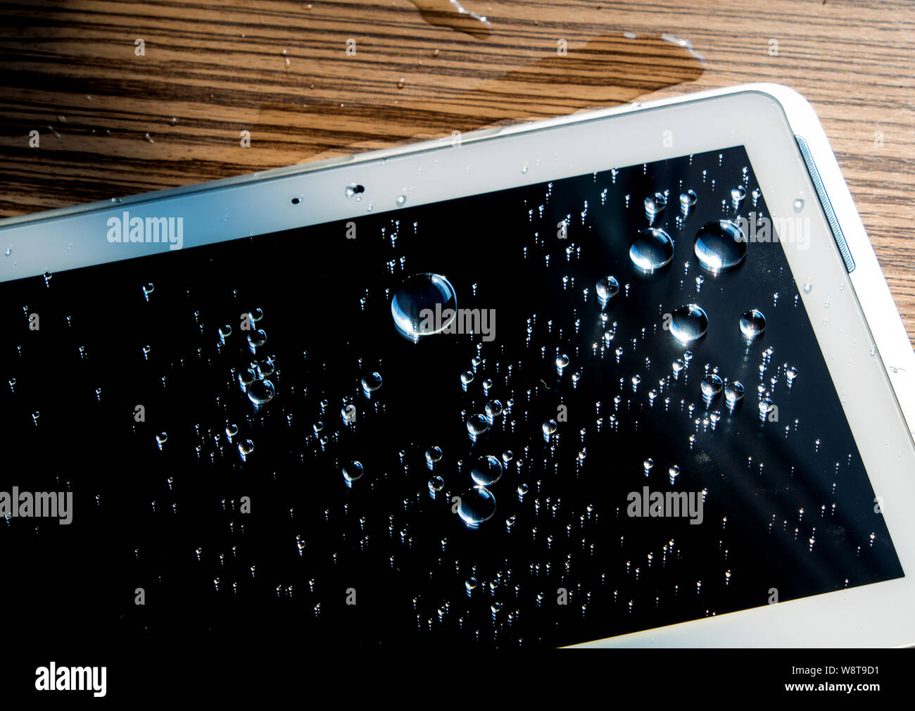 Water spilled onto the tablet, Drops of water on the tablet screen ...