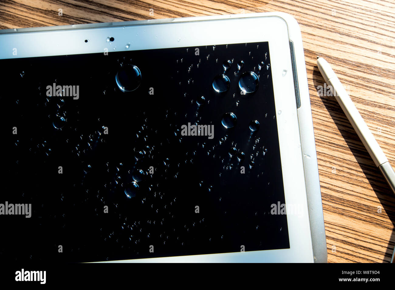 Water spilled onto the tablet, Drops of water on the tablet screen ...