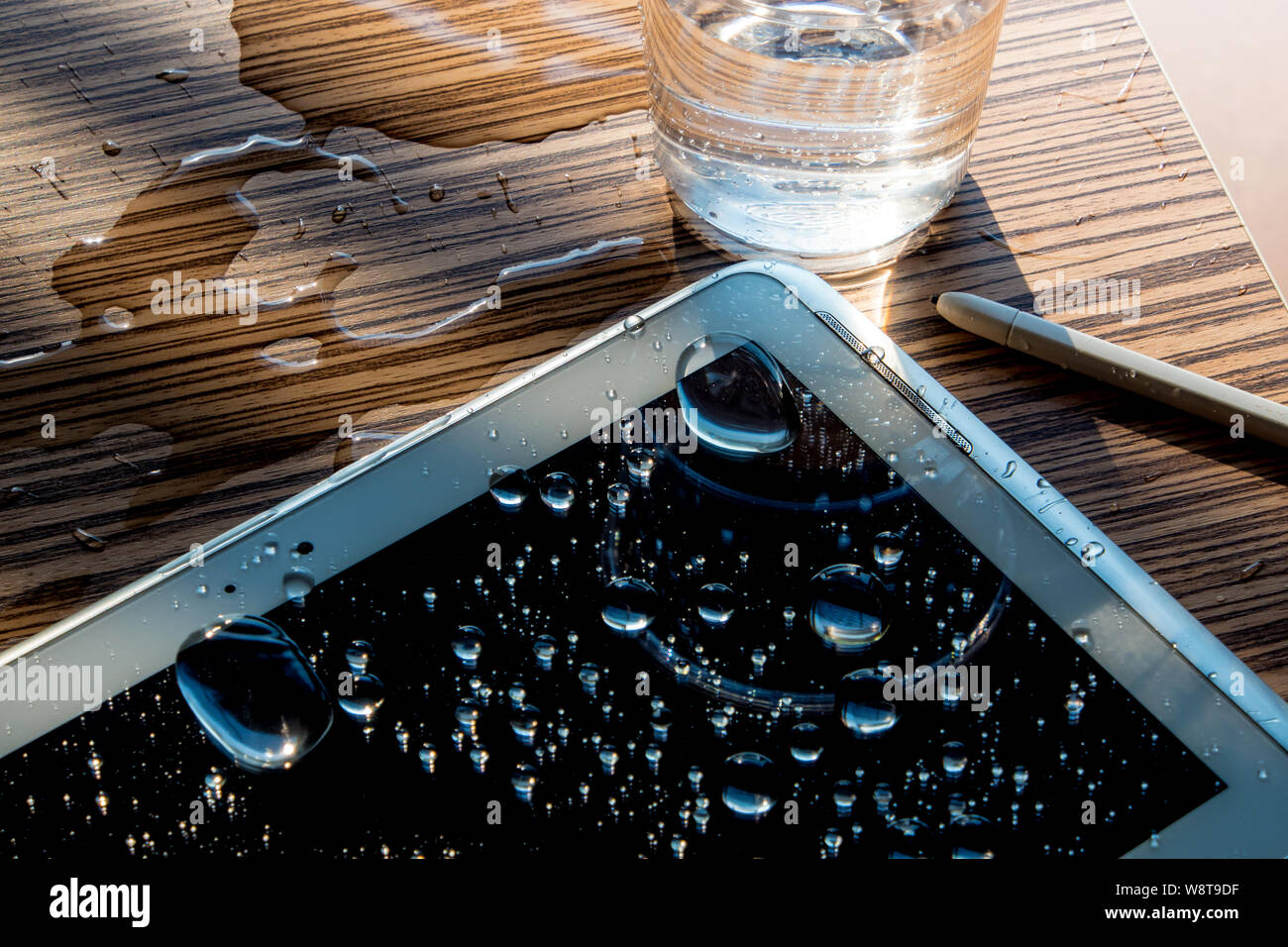 Water spilled onto the tablet, Drops of water on the tablet screen ...