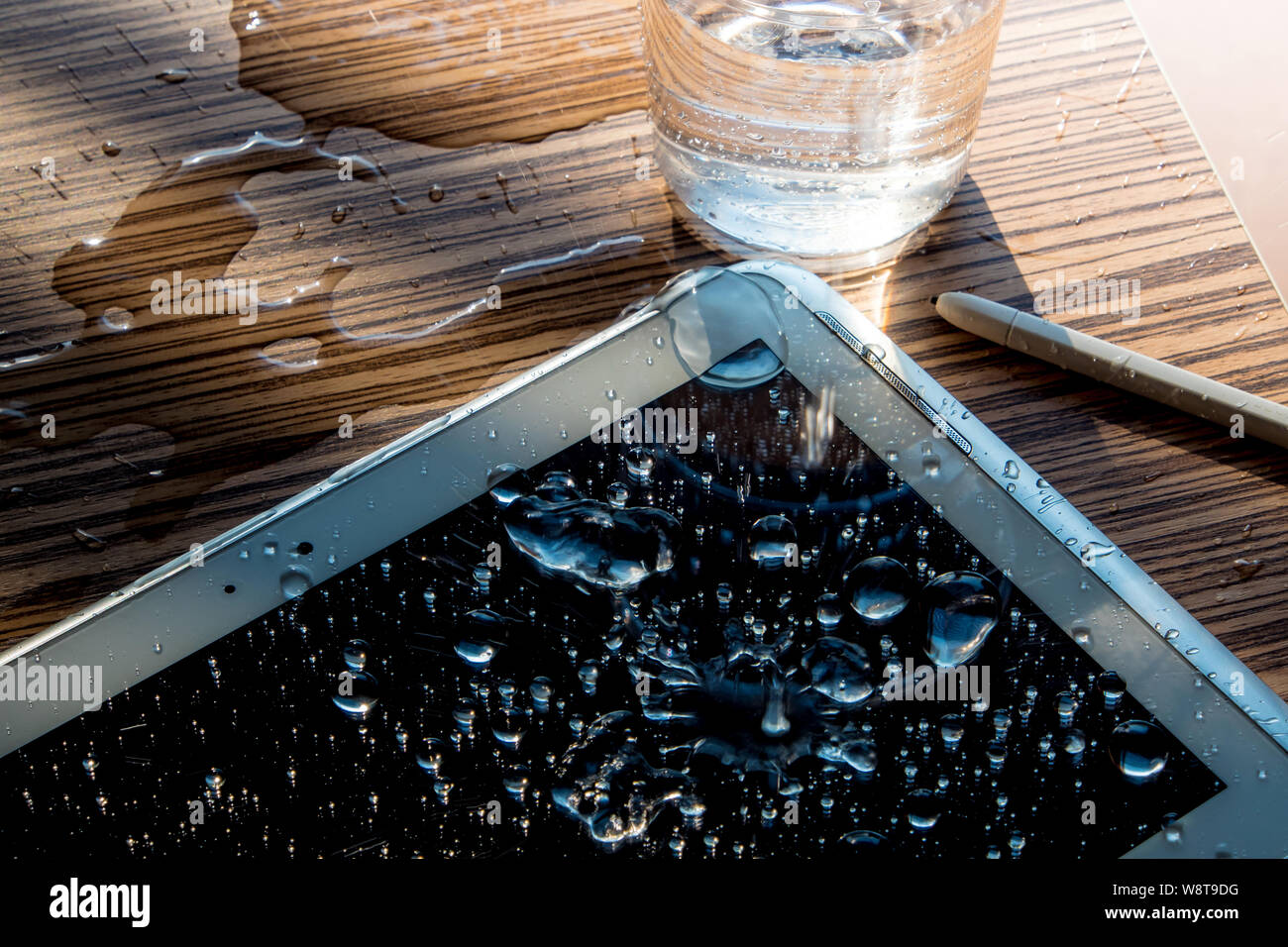 Water spilled onto the tablet, Drops of water on the tablet screen ...