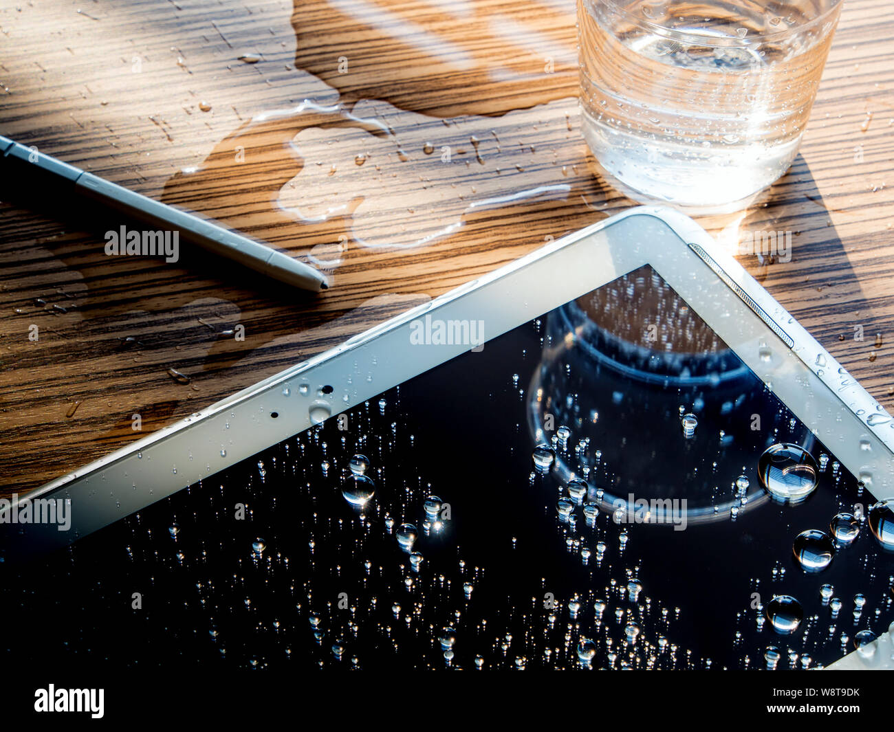 Water spilled onto the tablet, Drops of water on the tablet screen ...