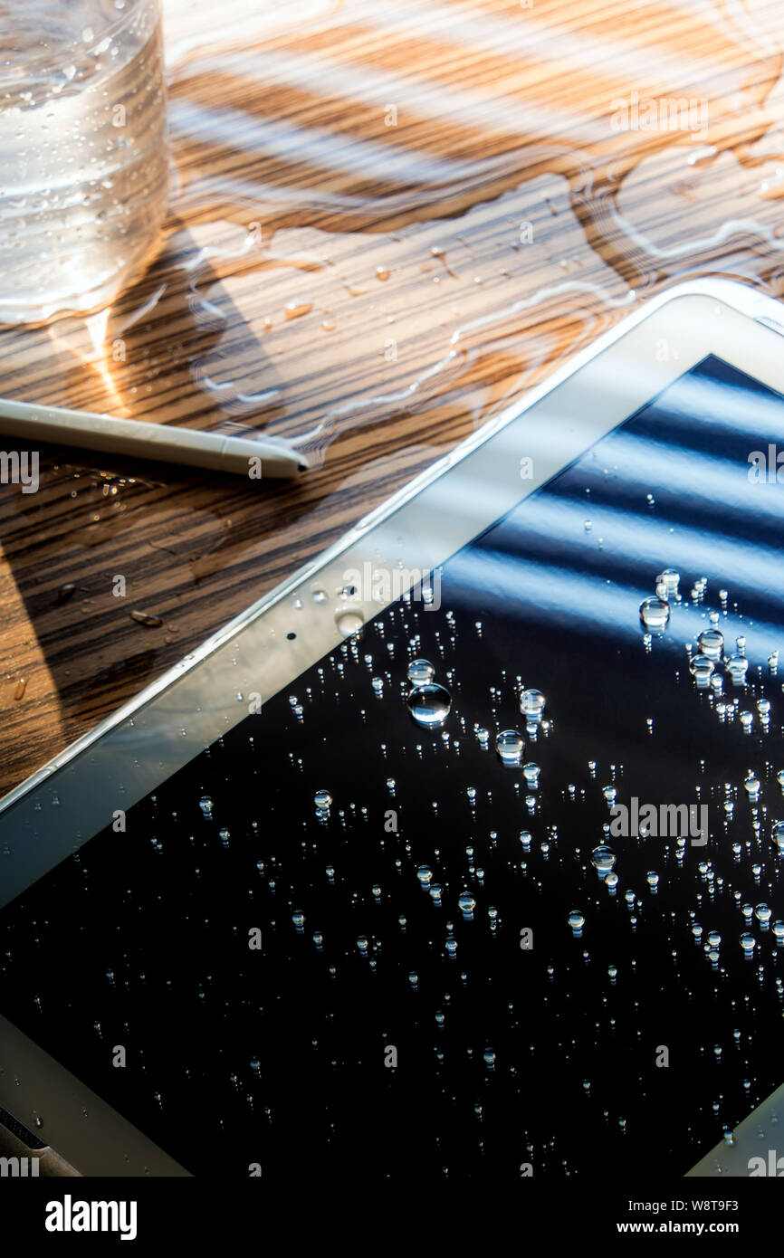 Water spilled onto the tablet, Drops of water on the tablet screen ...