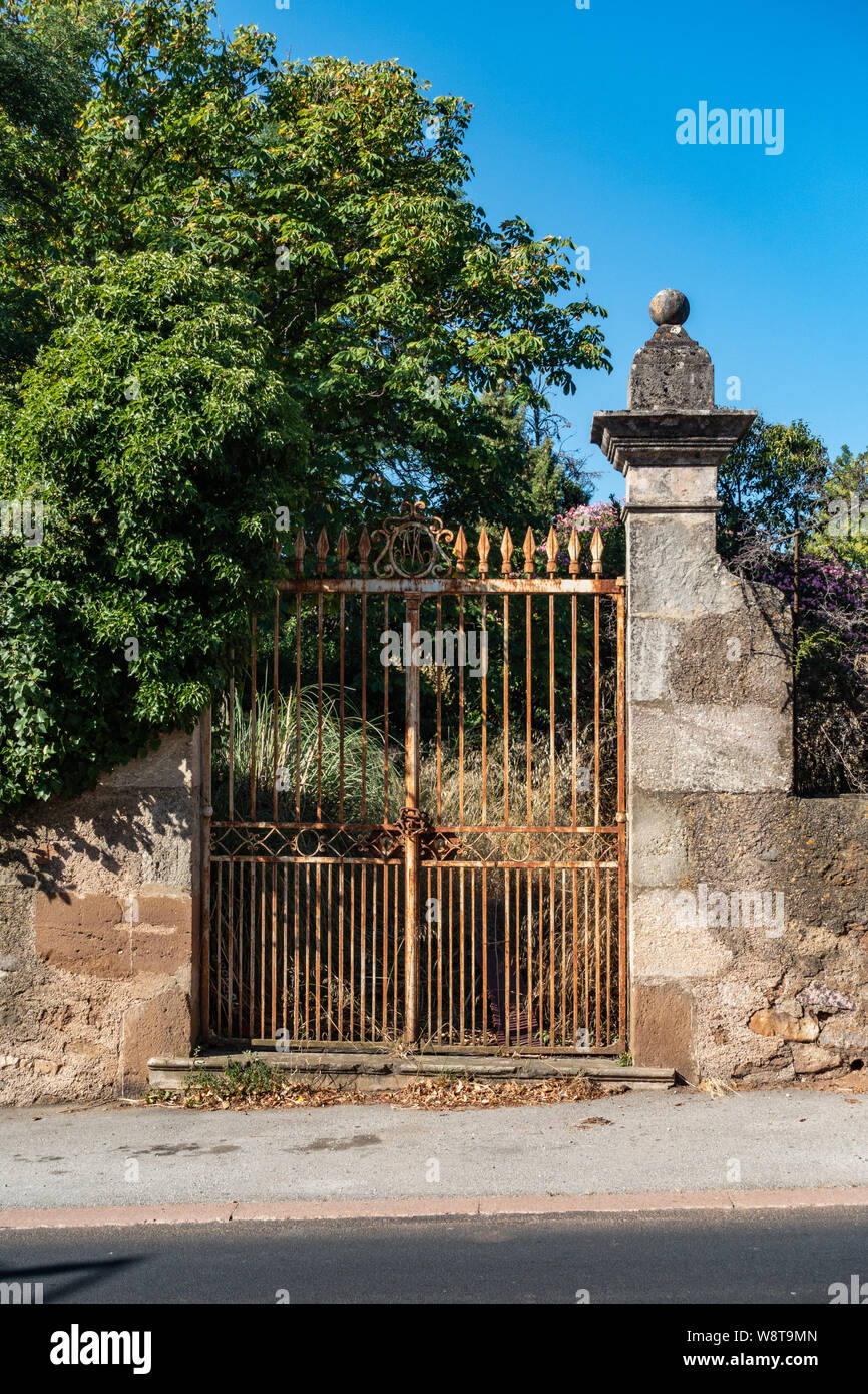 Antique very large wrought iron gates on French house drive Stock Photo ...