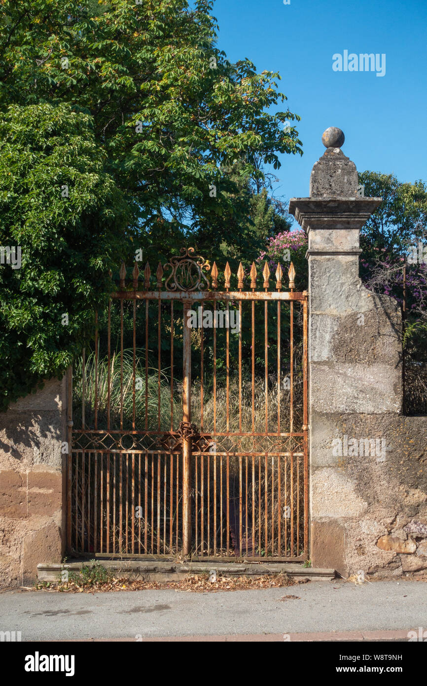 Antique very large wrought iron gates on French house drive Stock Photo ...
