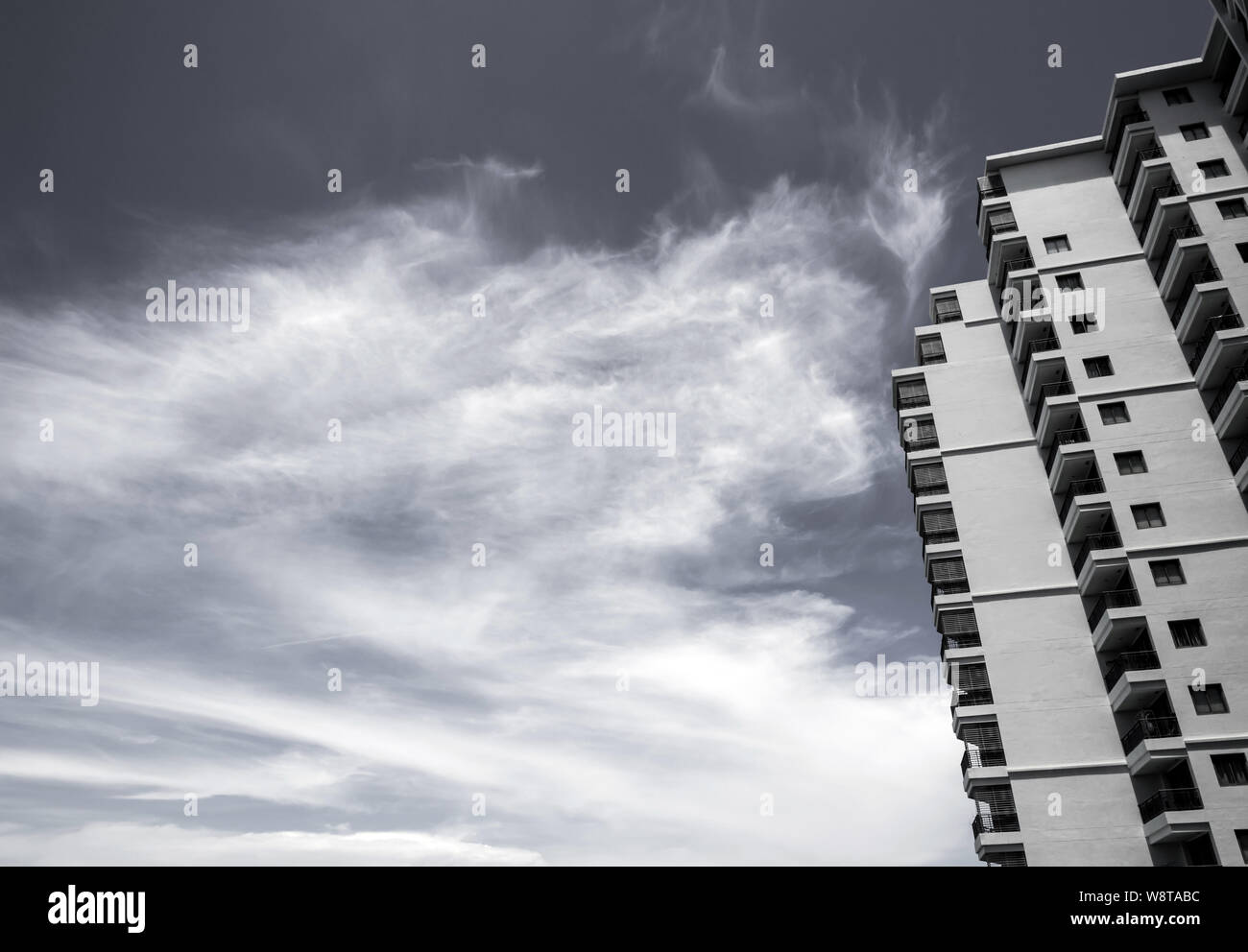 High-rise building and cloud in sky Stock Photo - Alamy