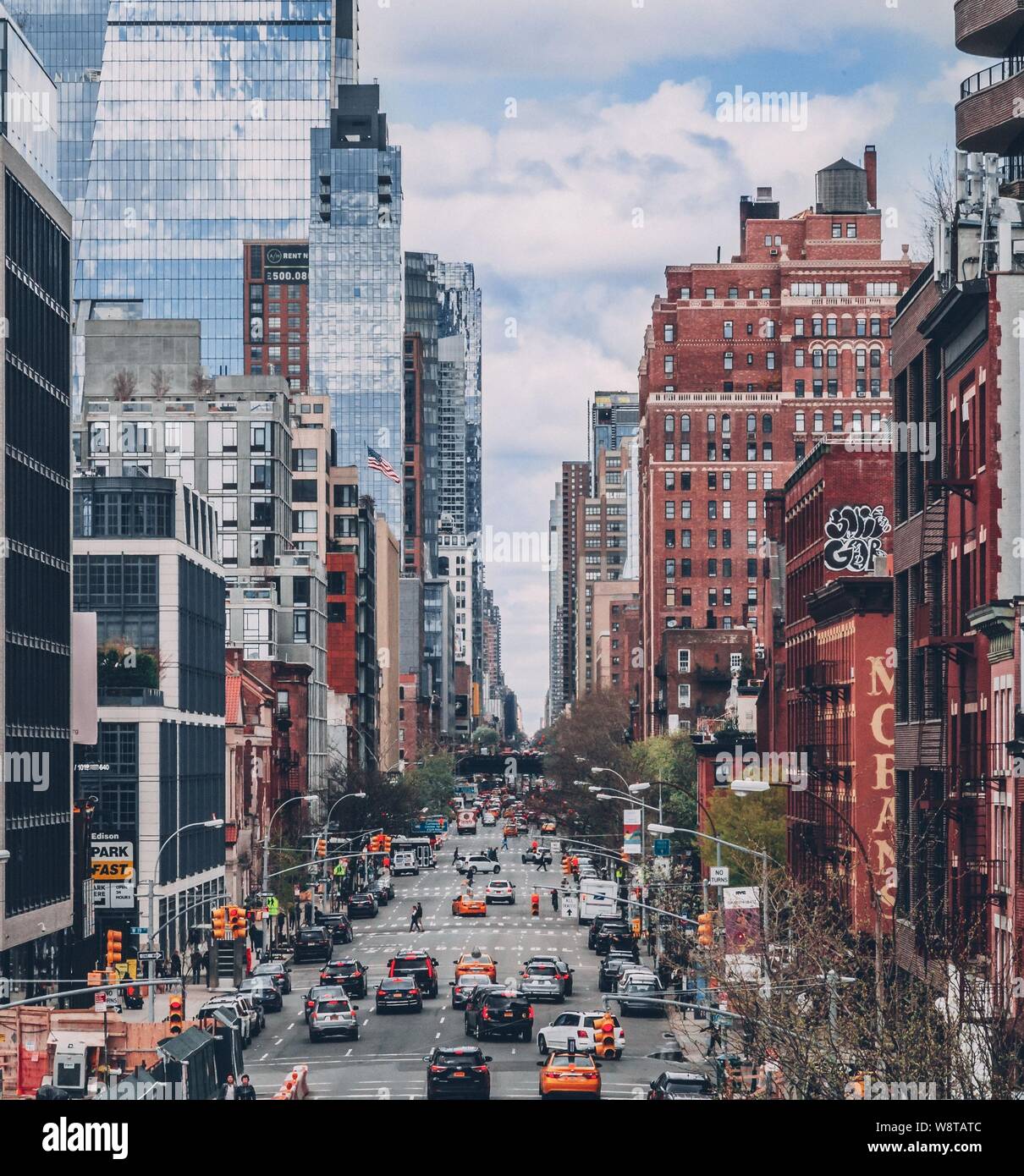Vertical Distant Shot of High-Rise Buildings And Vehicle On The Roads ...