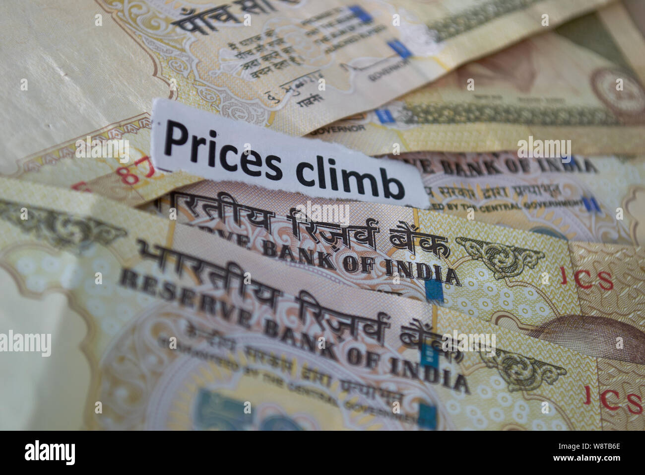 Indian paper currency representing prices climb Stock Photo - Alamy