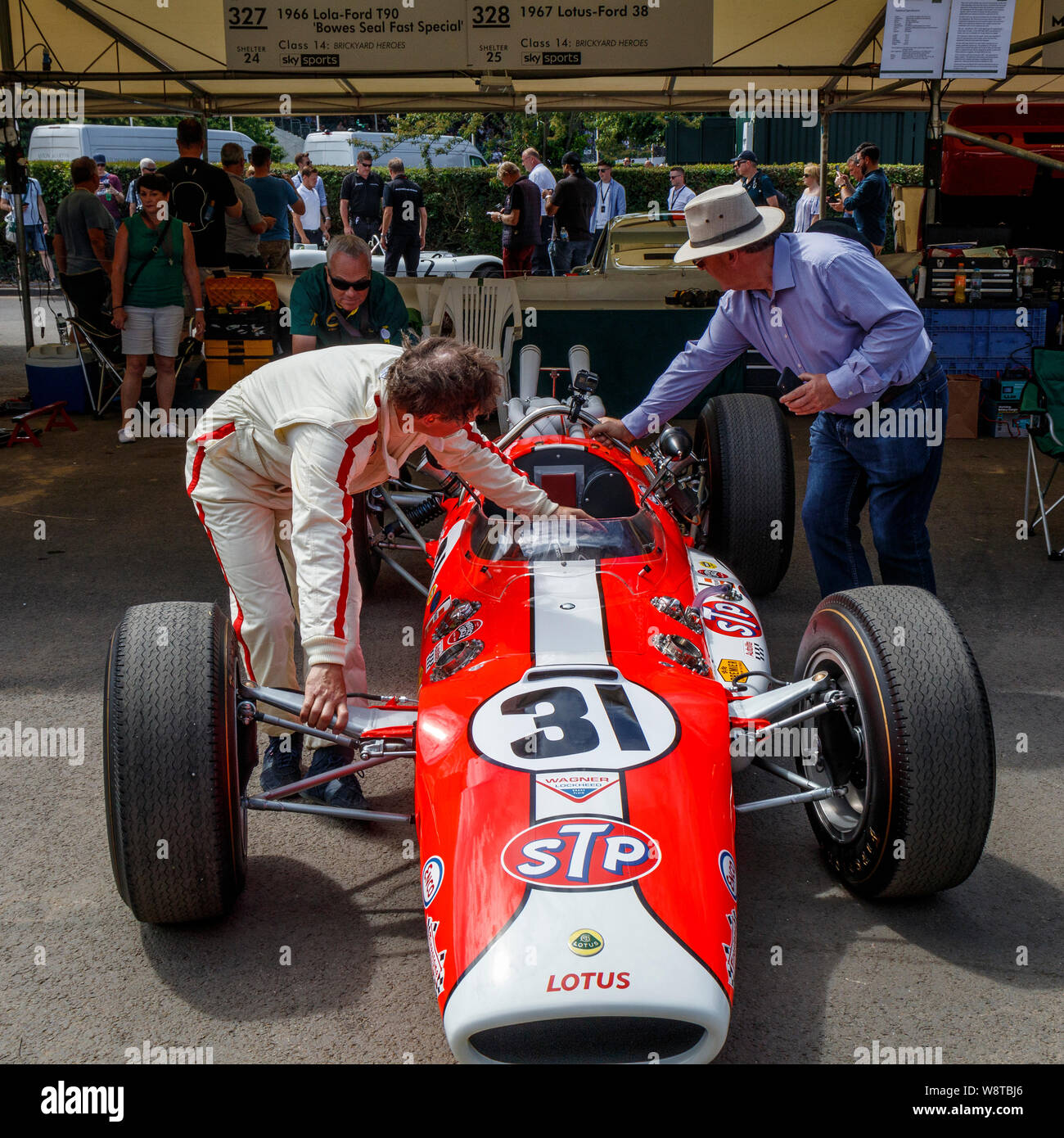 1967 Lotus-Ford 38 being moved in the paddock by driver Nick Fennell ...