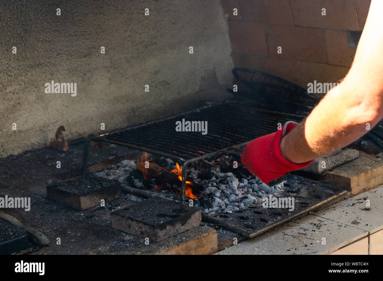 fire in a barbaque, setting fire on coal barbacue Stock Photo - Alamy