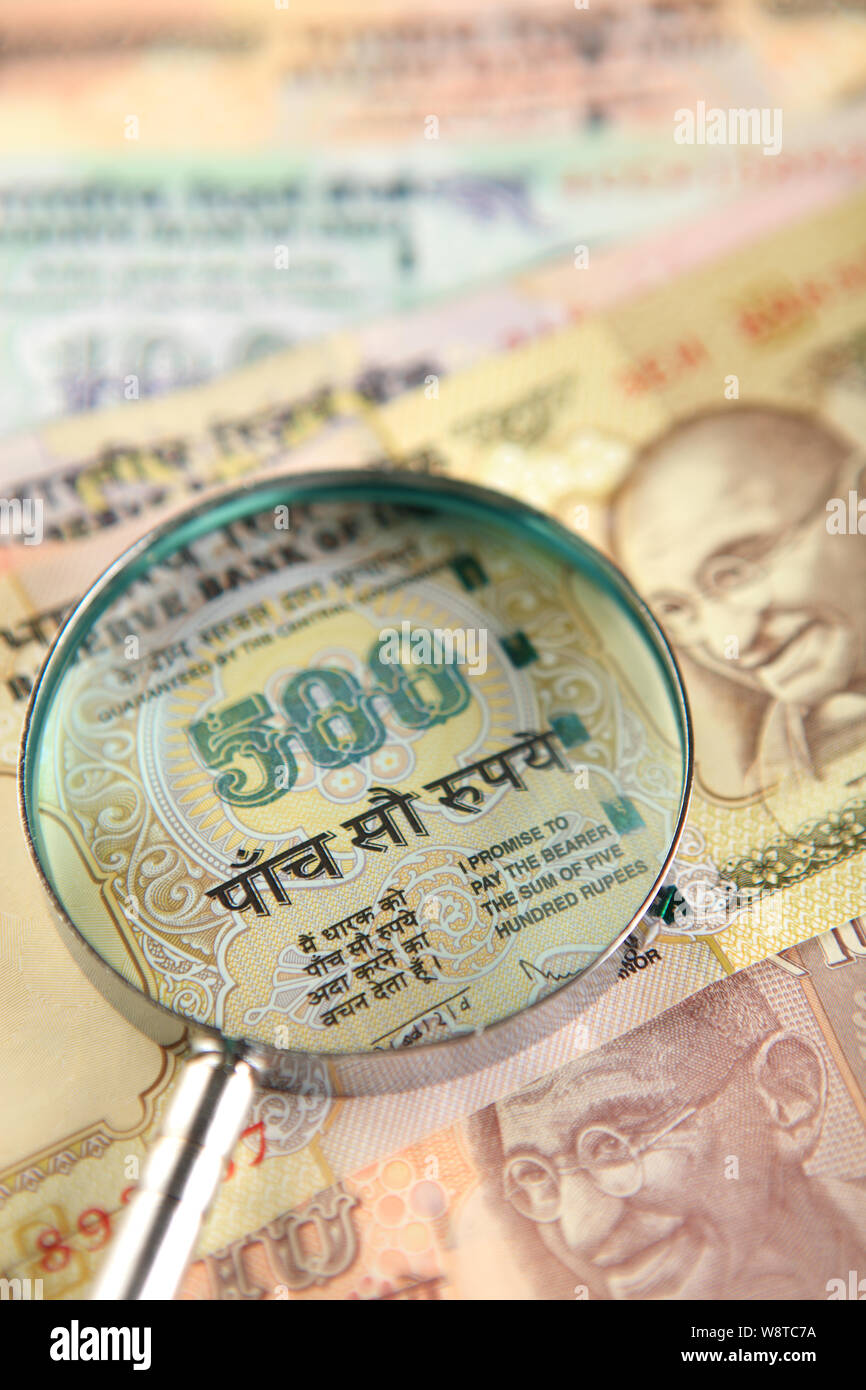 Five hundred rupee note looks through a magnifying glass Stock Photo ...