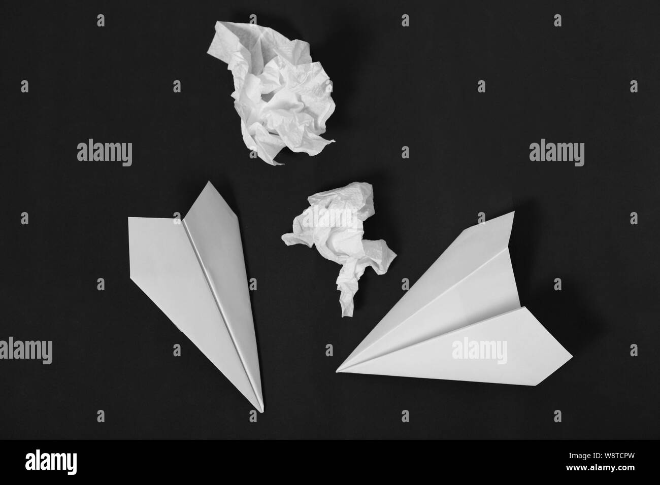 Paper aeroplanes representing aeroplane crash Stock Photo - Alamy