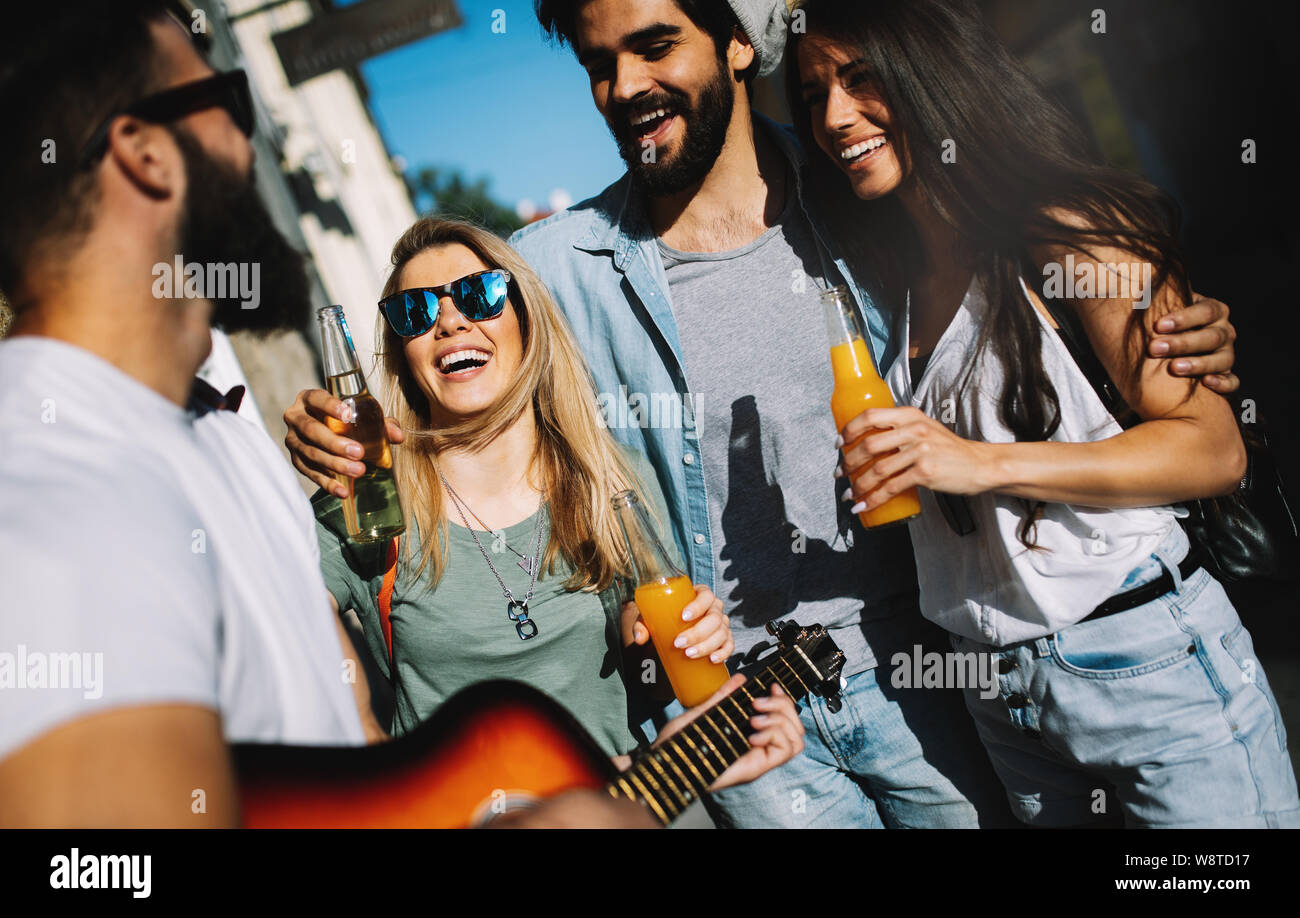 Group of friends hanging out, having fun and enjoying summer days Stock ...