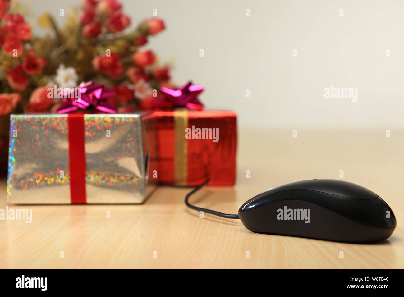 Gift boxes connected with a computer mouse Stock Photo - Alamy