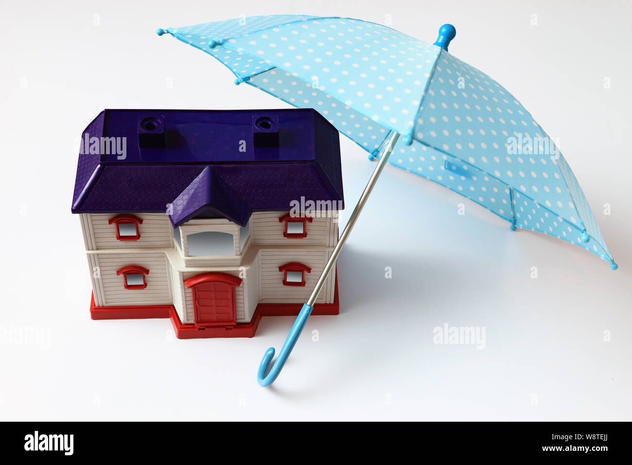 House covered by an umbrella Stock Photo - Alamy