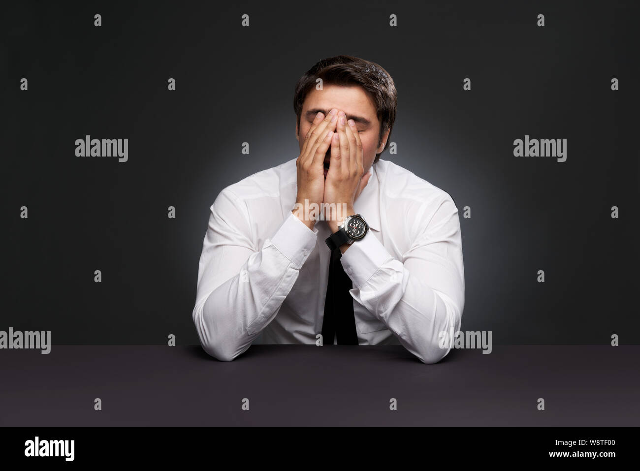Businessman looking sad Stock Photo - Alamy