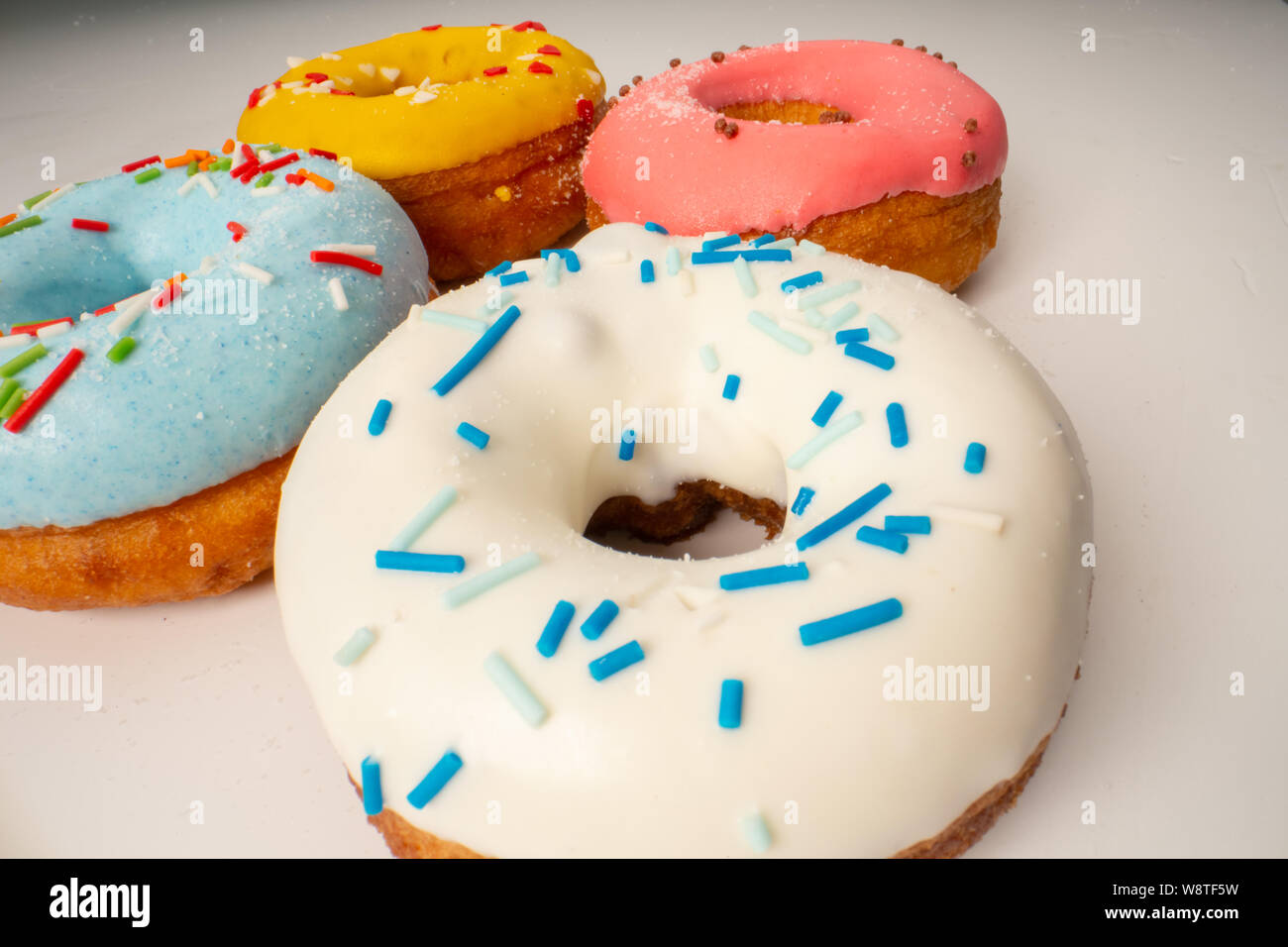 Different big donuts with glaze. Assortment of various colorful donuts ...