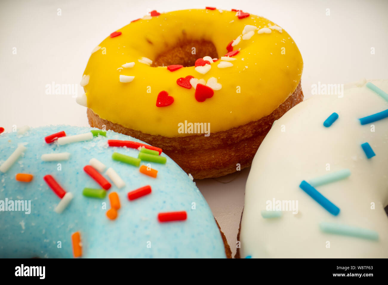 Different big donuts with glaze. Assortment of various colorful donuts ...