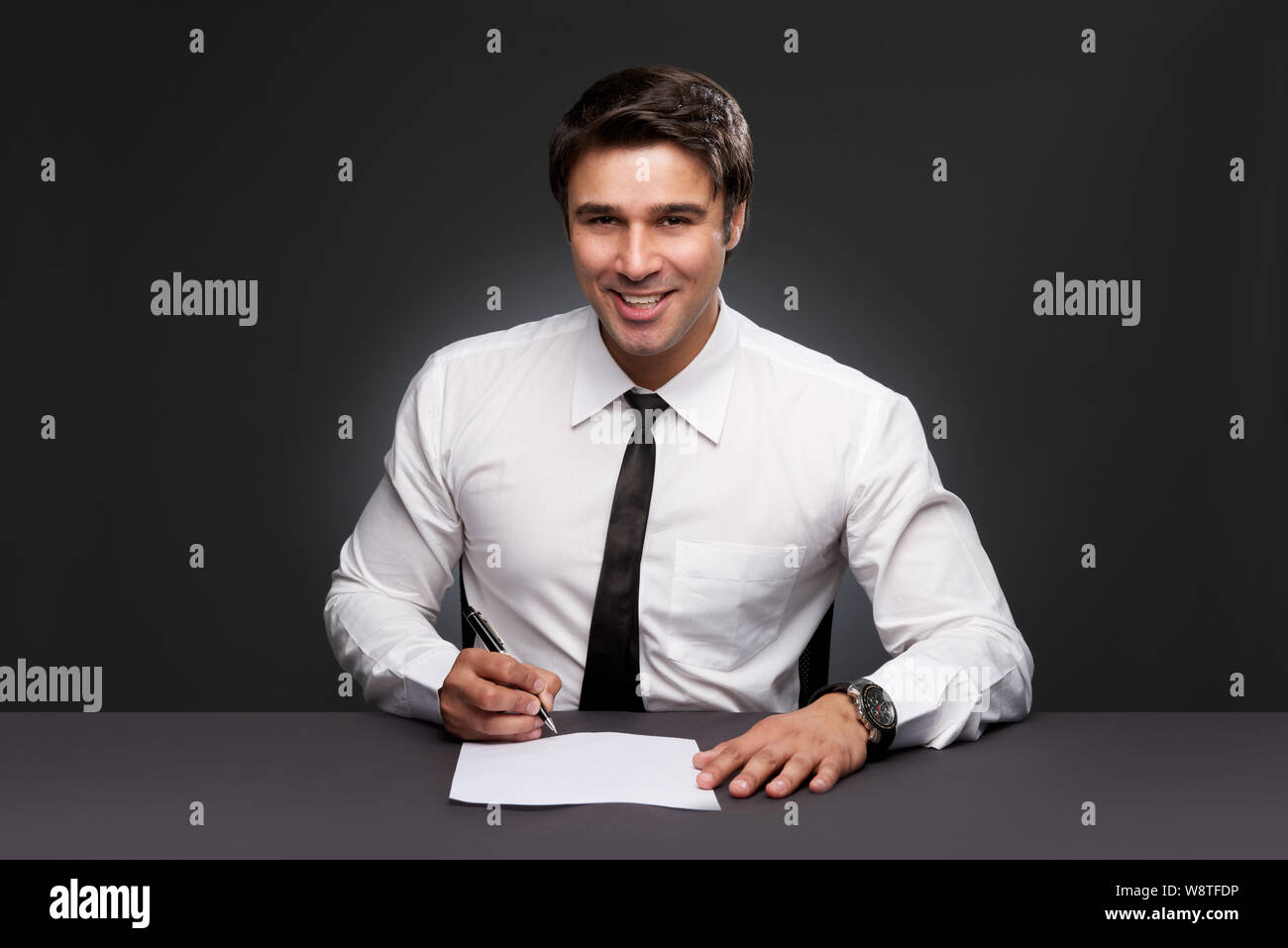 Signing document happy hi-res stock photography and images - Alamy