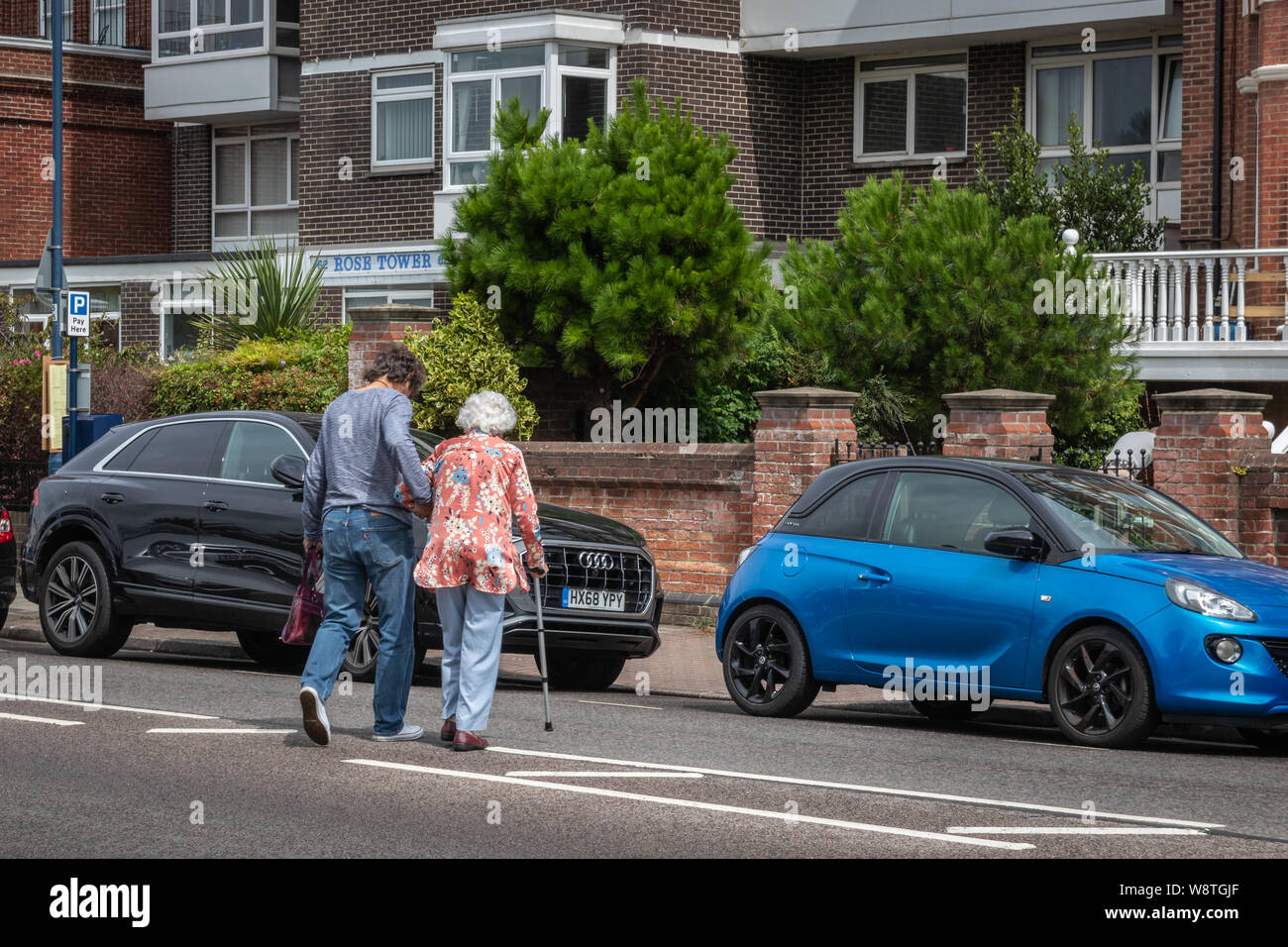 Children Helping The Elderly Cross The Road
