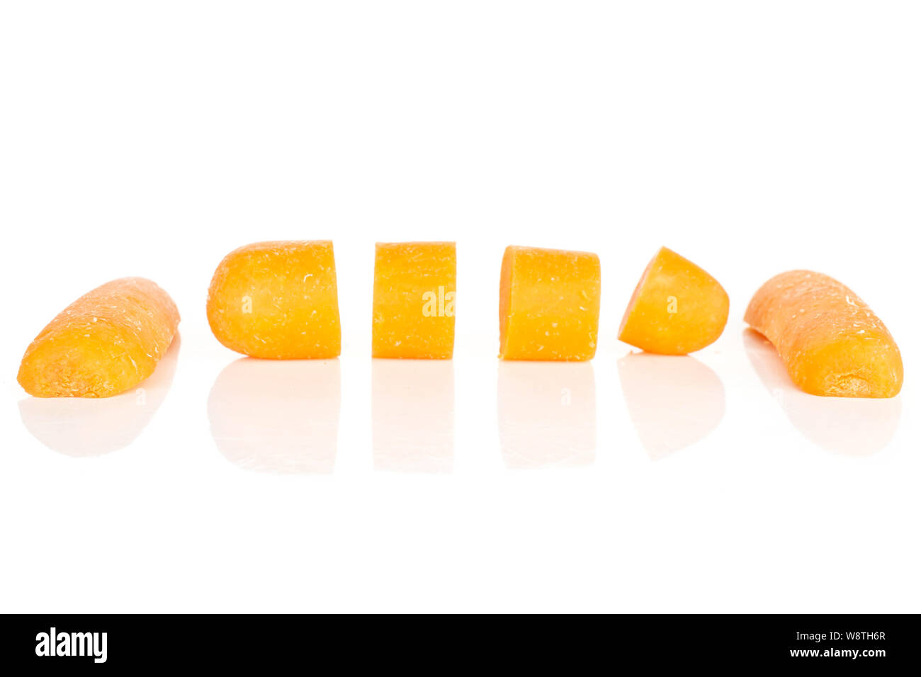 Group of two halves four quarters of stale orange stale baby carrot ...