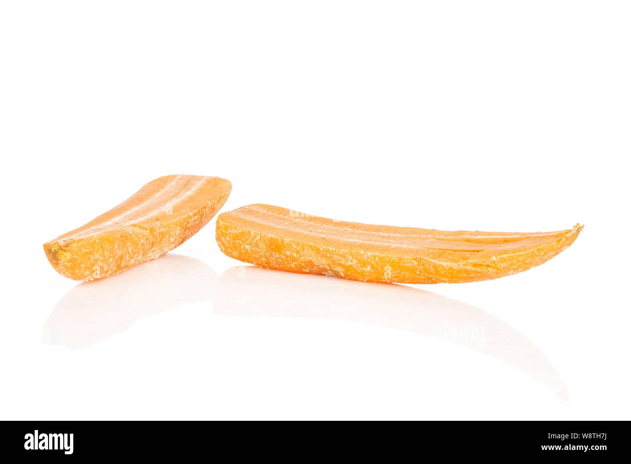 Group of three halves of stale orange stale baby carrot baby isolated ...