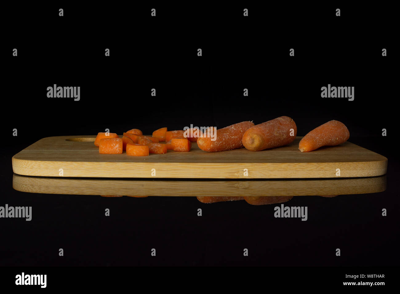 Group of three whole lot of pieces of stale orange stale baby carrot ...