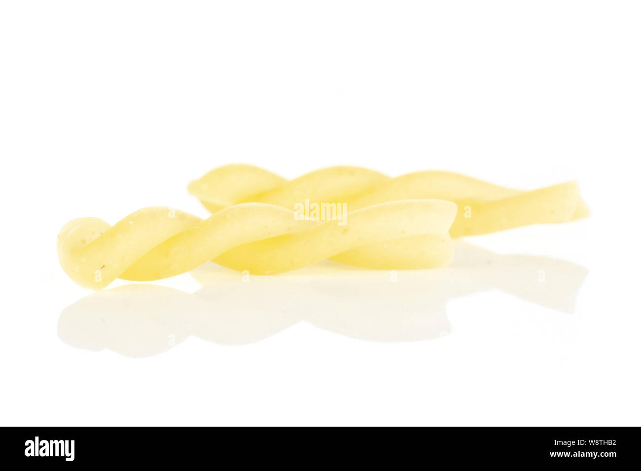 Group of two whole raw pasta gemelli isolated on white background Stock ...