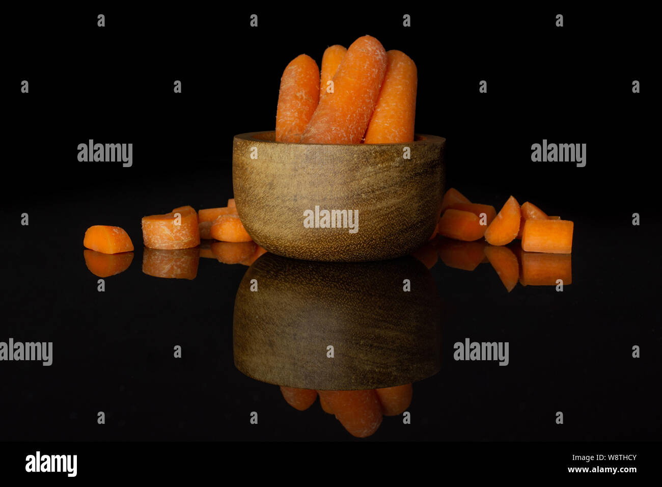 Group of four whole lot of pieces of stale orange stale baby carrot ...