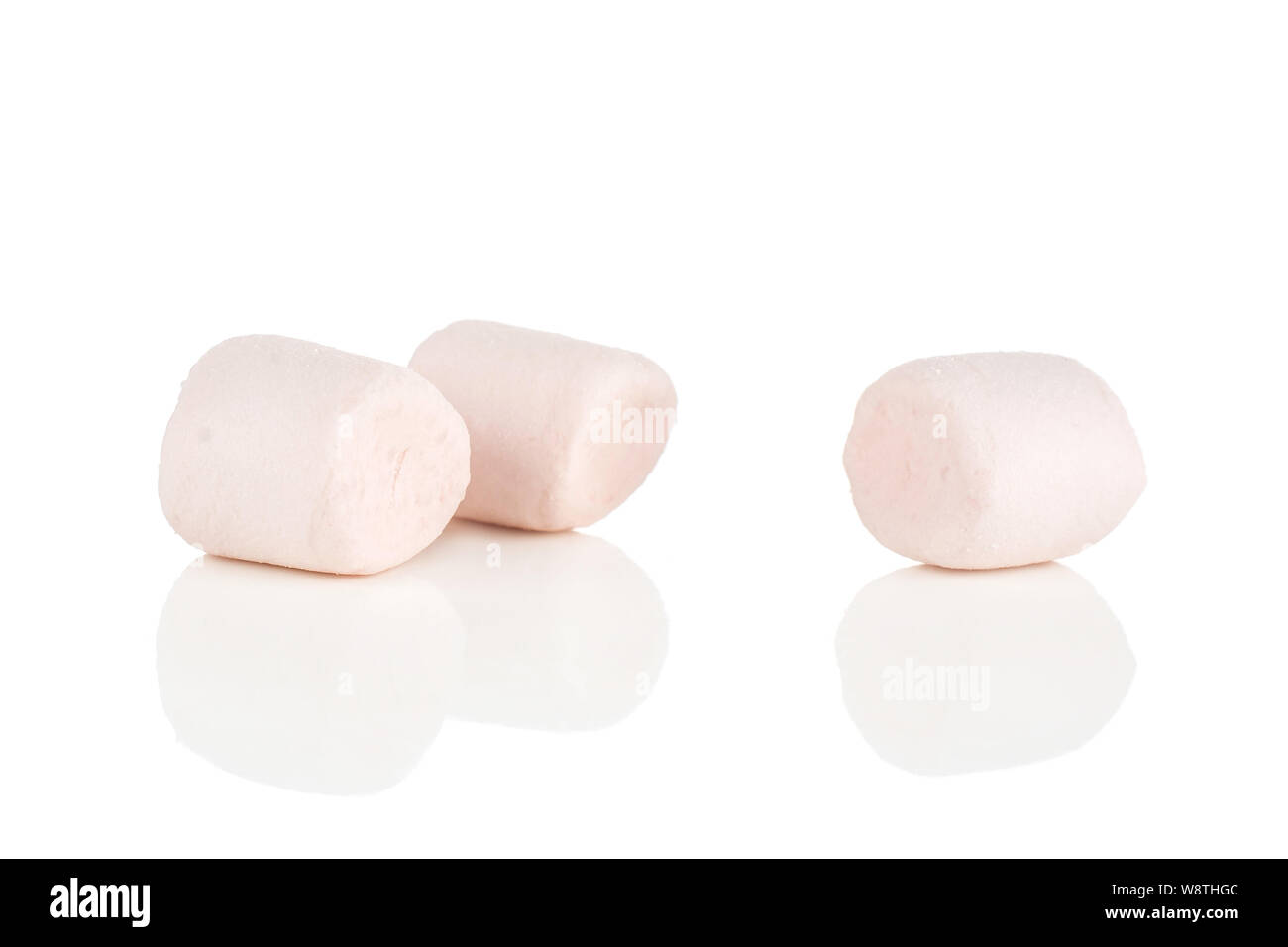 Group of three whole sweet fluffy marshmallow isolated on white ...