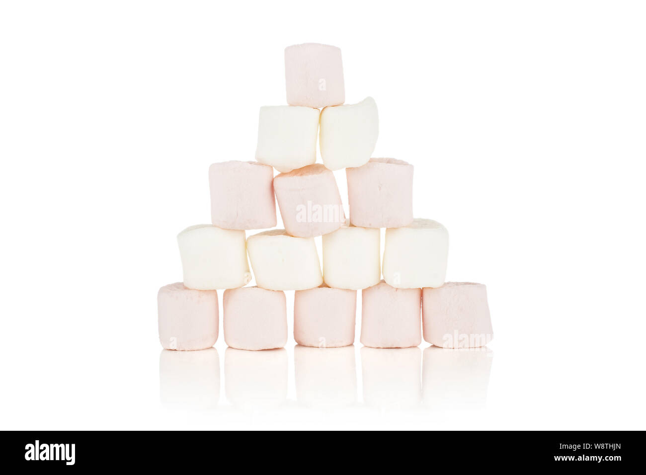 Lot of whole sweet fluffy marshmallow pyramid isolated on white ...