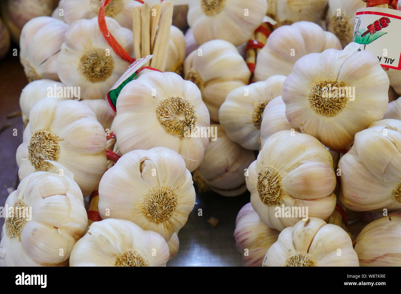 Garlic displayed on stall at the covered market, Saint-Jean du Gard ...