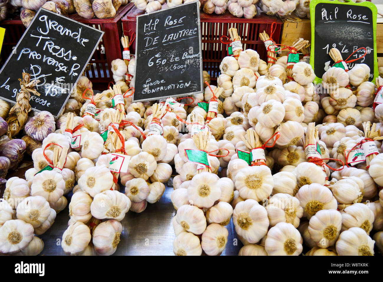 Garlic displayed on stall at the covered market, Saint-Jean du Gard ...