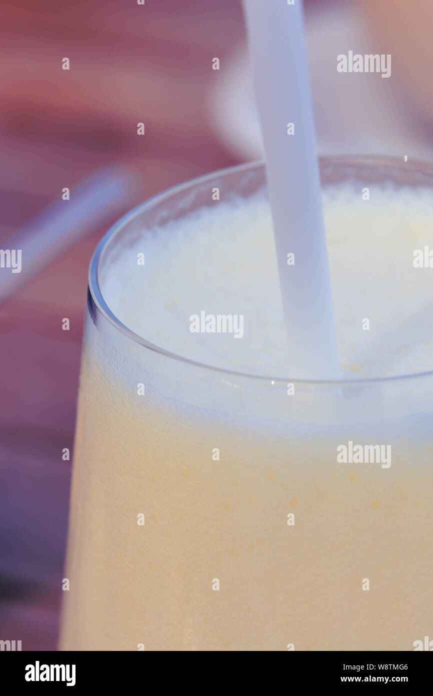 Close up delicious homemade milkshake with straw texture background ...
