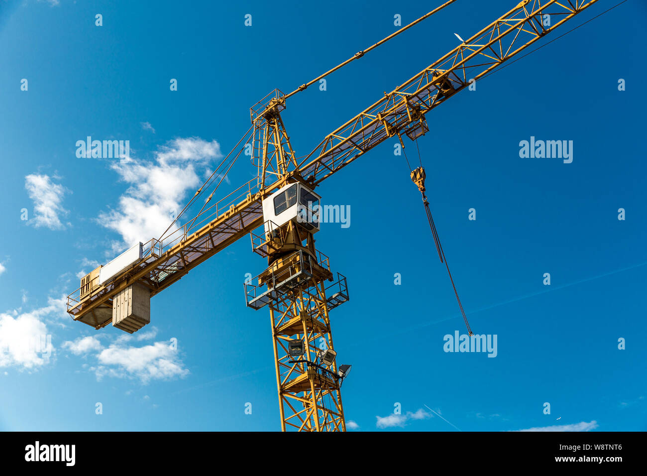 Construction site in european city, tower crane Stock Photo - Alamy