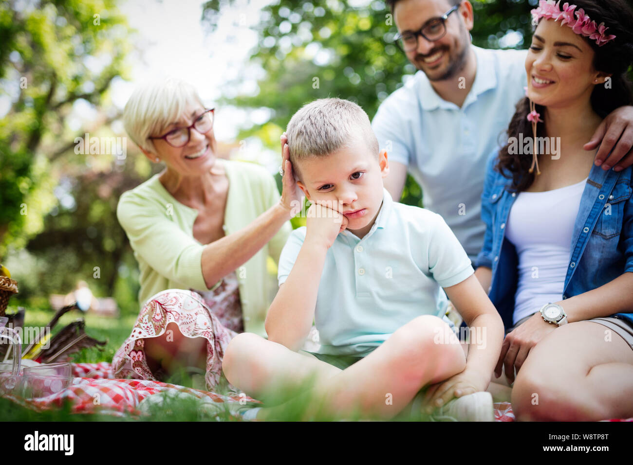 Family consoling little stubborn child and managing emotions Stock ...