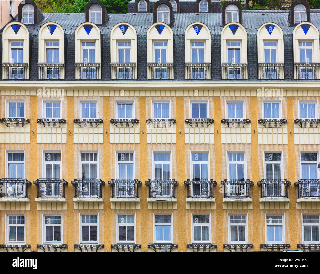 Building facade with balconies, old European town Stock Photo - Alamy