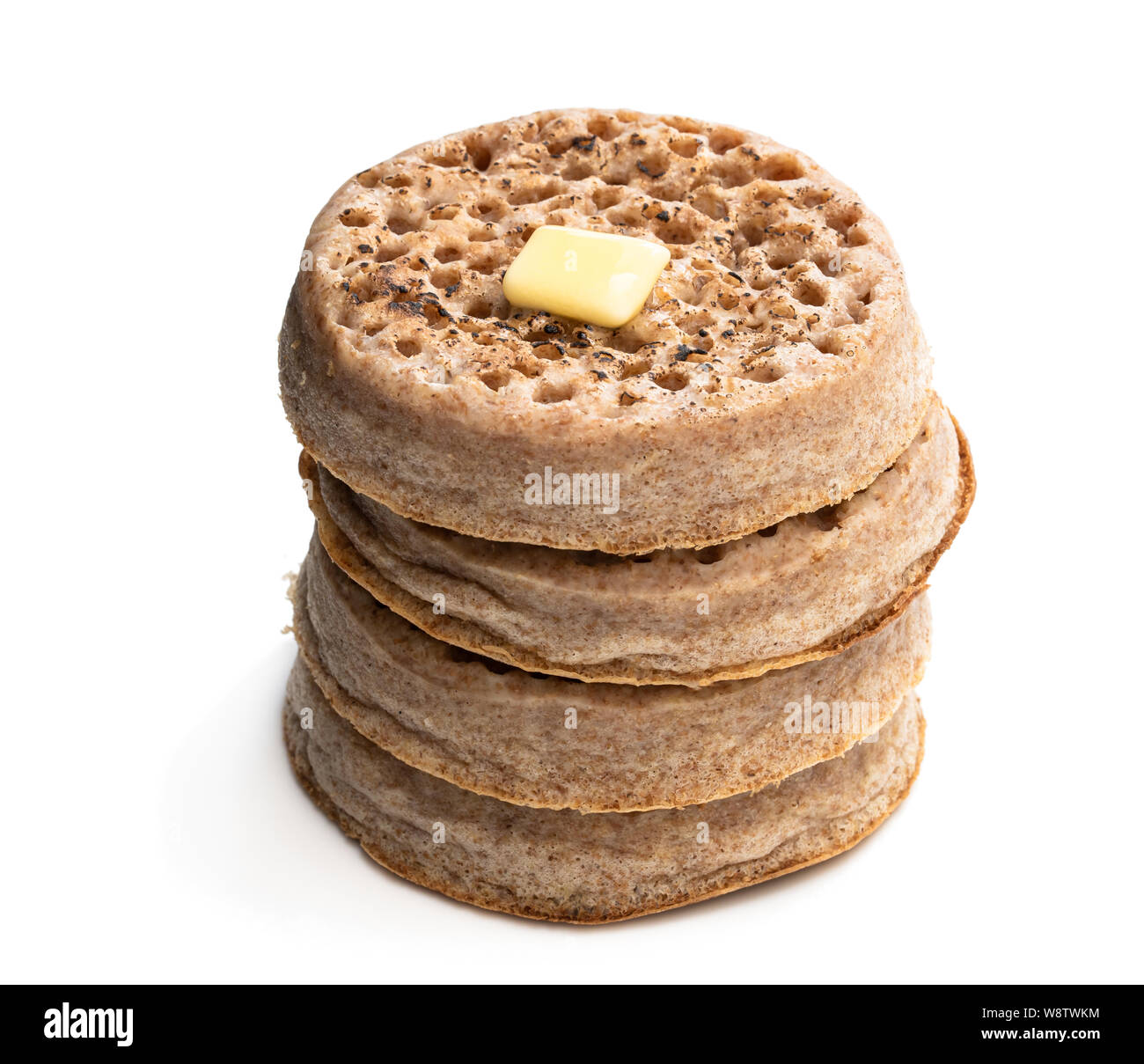 Stack of wholemeal crumpets isolated on white background Stock Photo ...