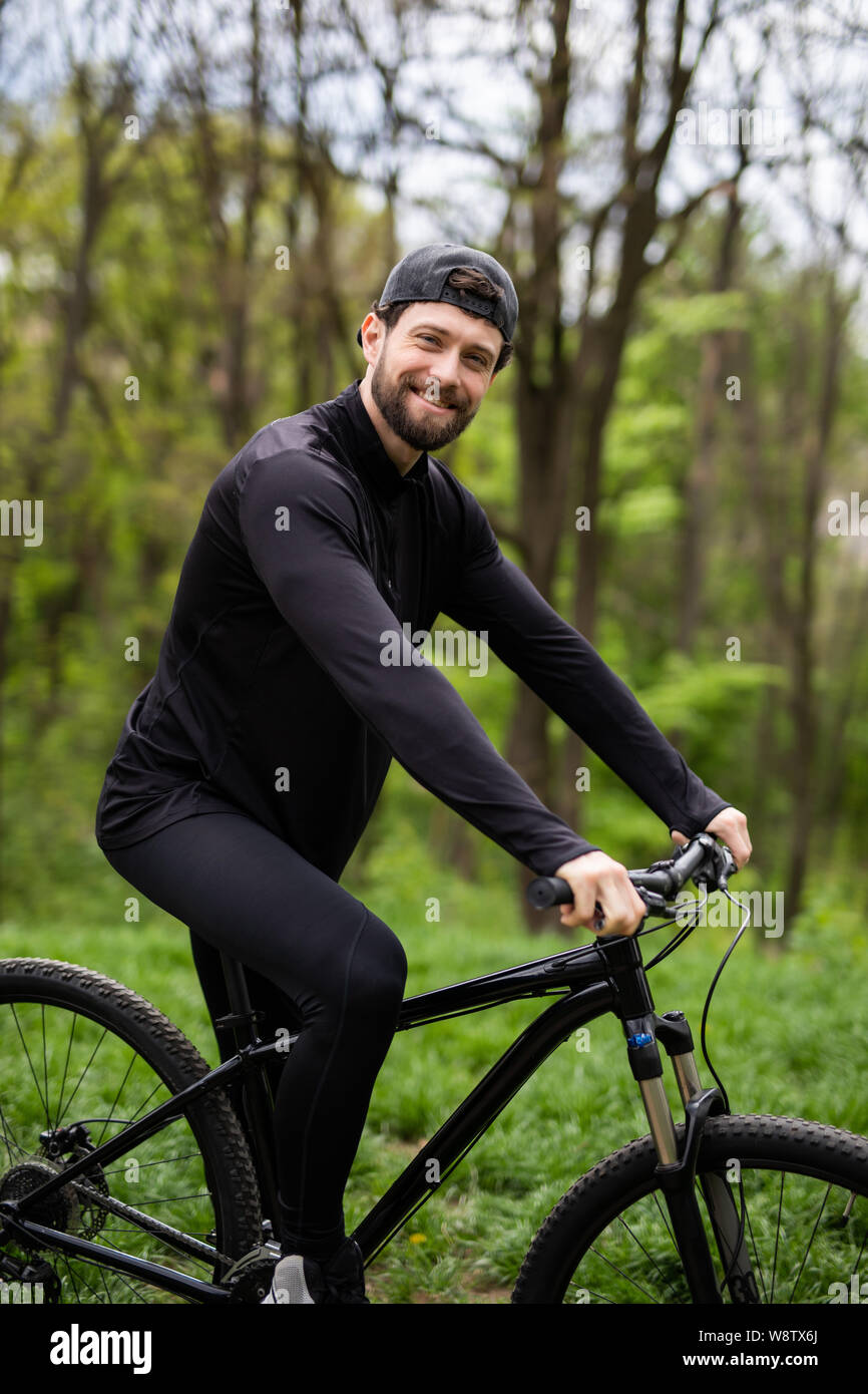 Biker standing at back wheel hi-res stock photography and images - Alamy