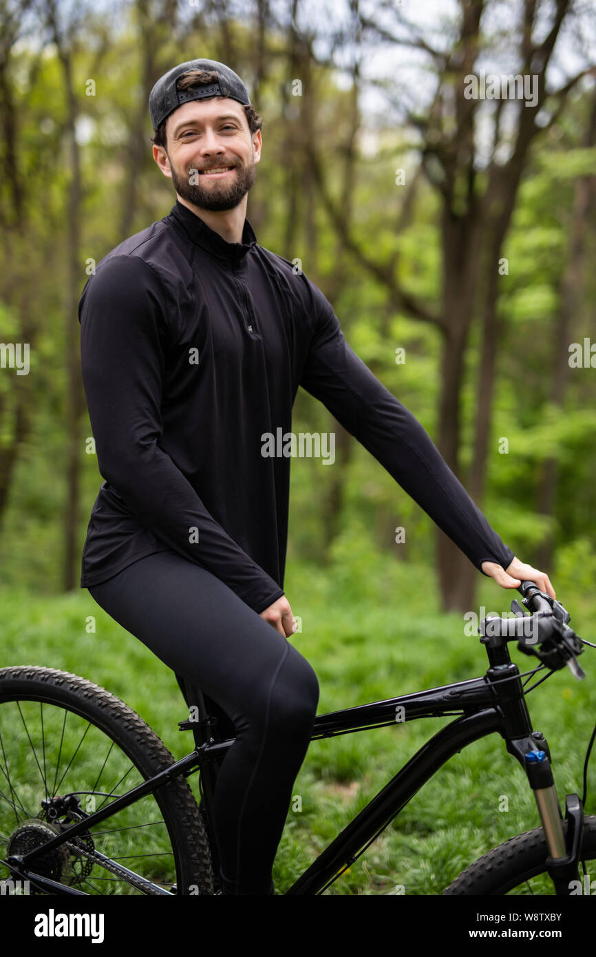 Mountain biker riding on bike in spring inspirational mountains ...