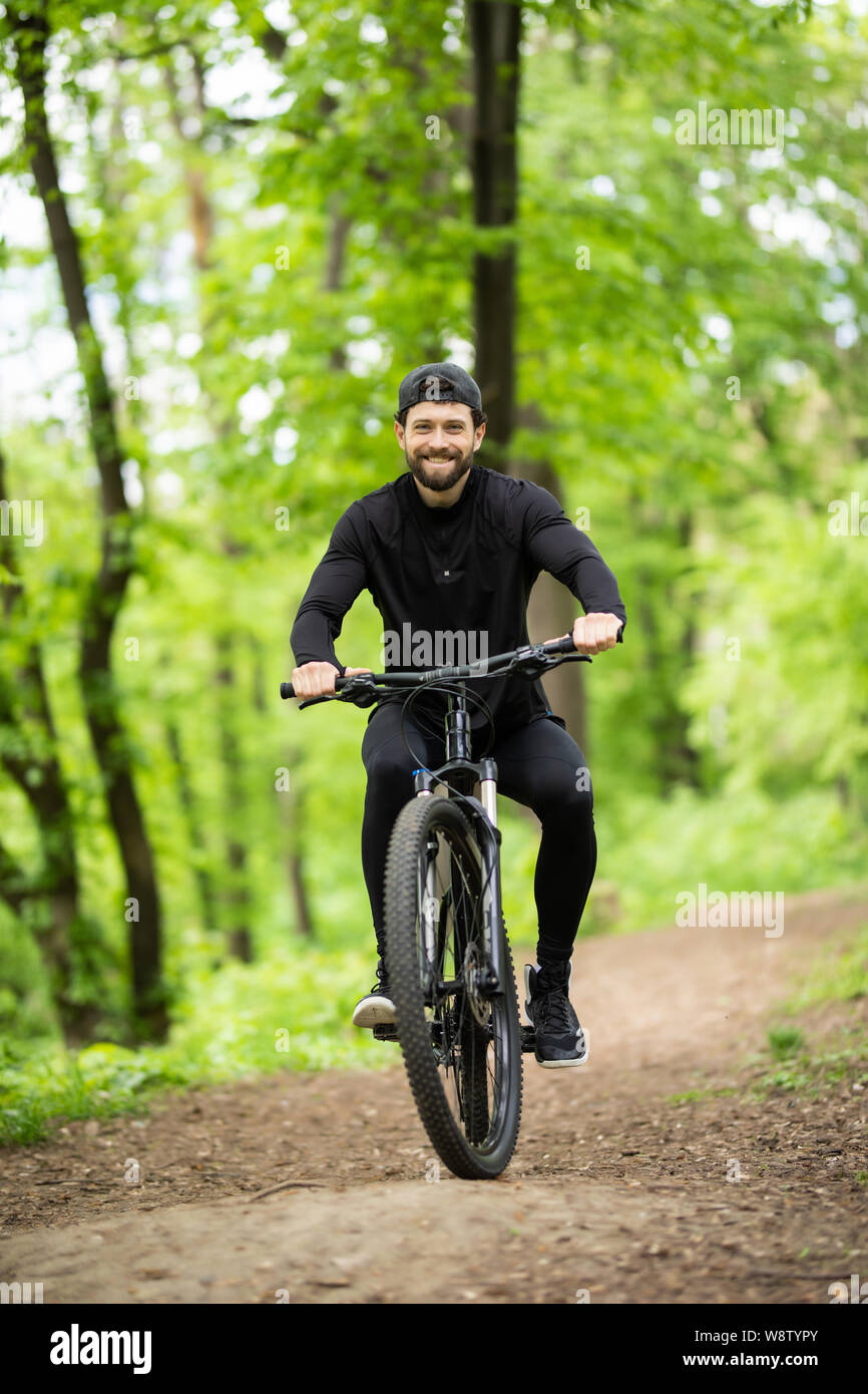 Male cycling through woodland hi-res stock photography and images - Alamy