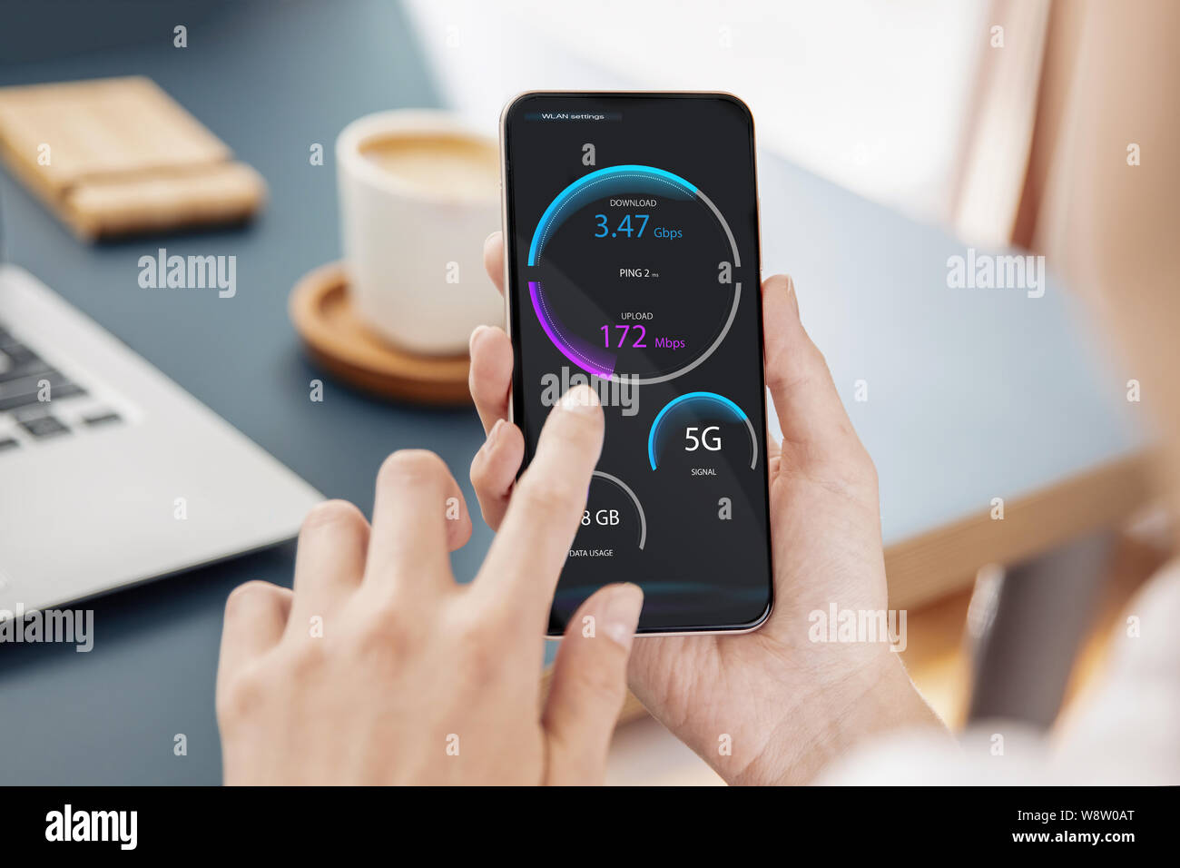 Woman checks wireless connection of 5G technology on her smartphone ...