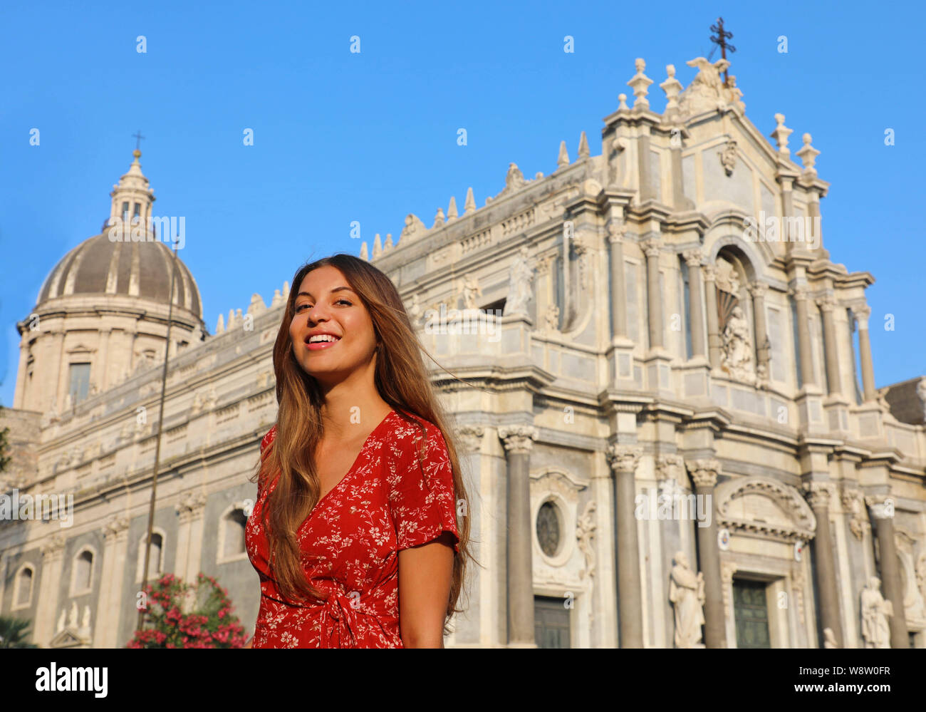Smiling young tourist girl visiting Catania Cathedral in Sicily. Summer ...