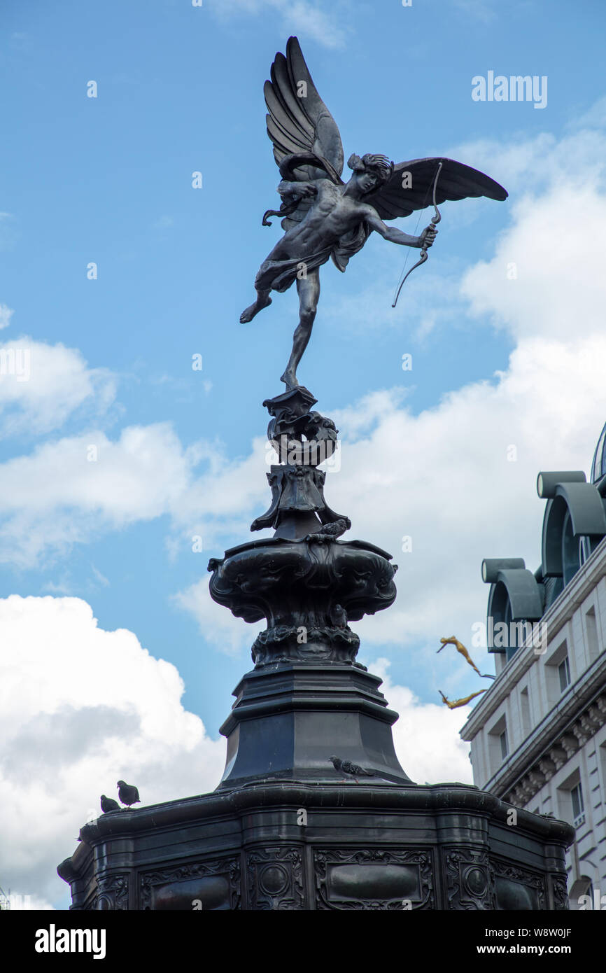 Statue of Anteros on the Shaftsbury Memorial Fountain with two of the ...