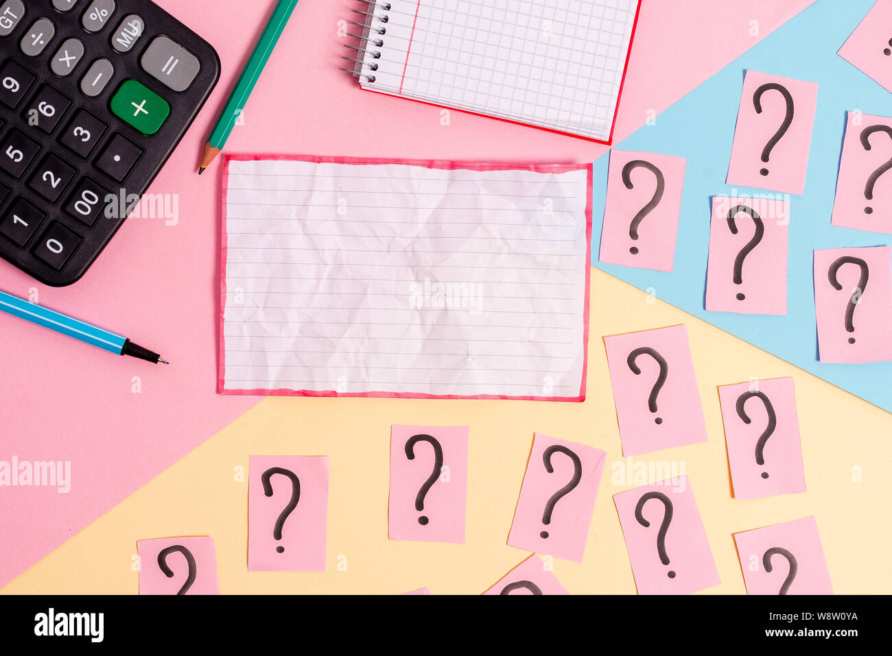 Mathematics stuff and writing equipment above pastel colours background ...