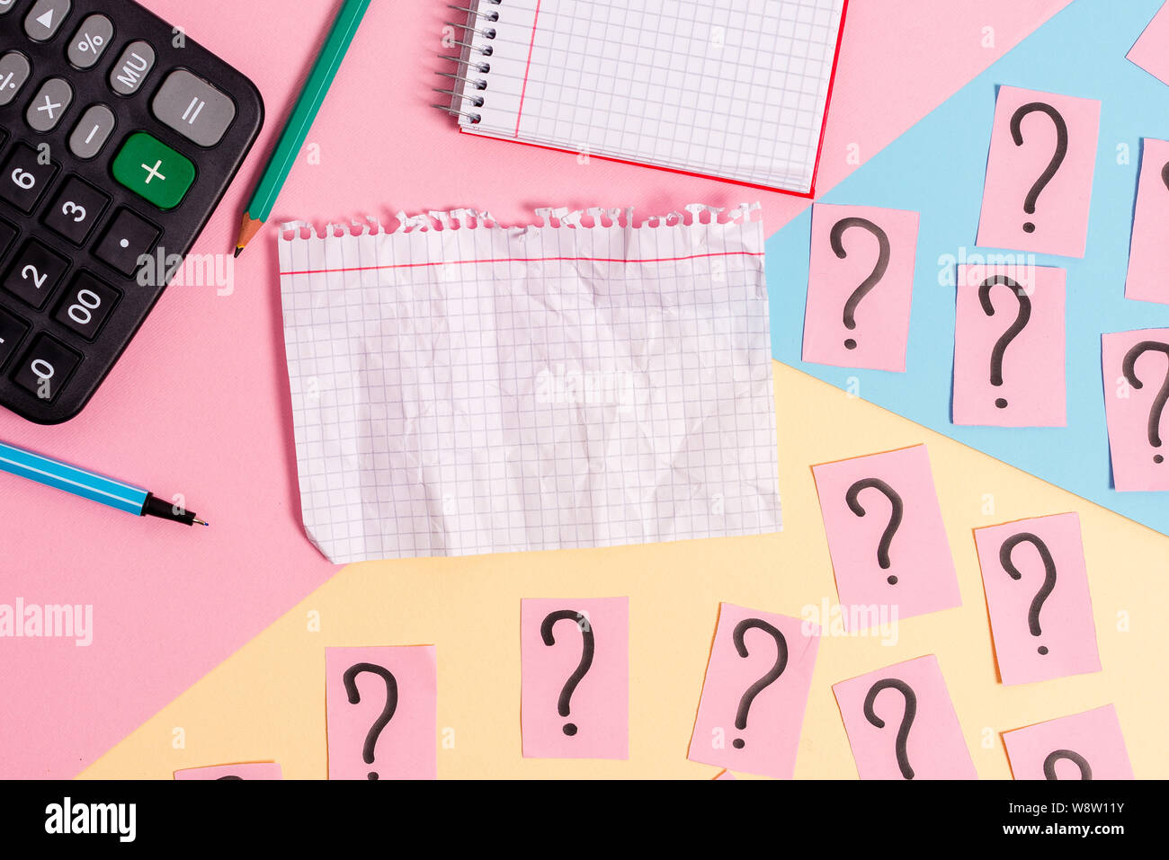 Mathematics stuff and writing equipment above pastel colours background ...