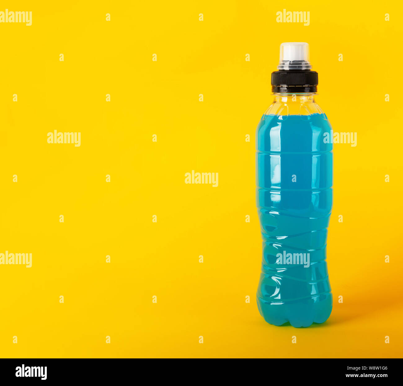 Isotonic energy drink. Bottles with blue transparent liquid, sport ...