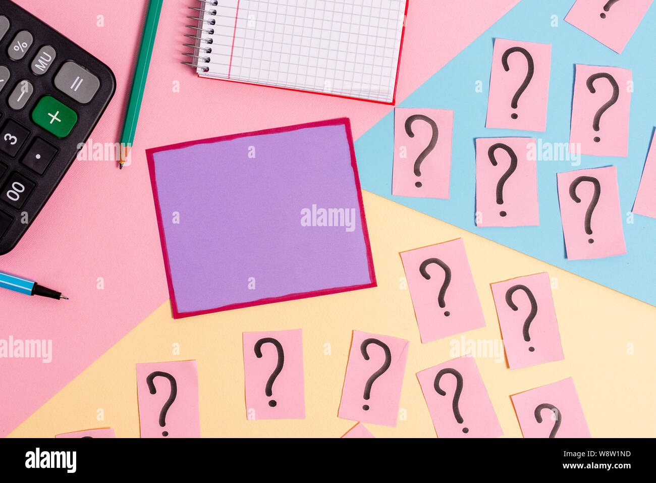 Mathematics stuff and writing equipment above pastel colours background ...