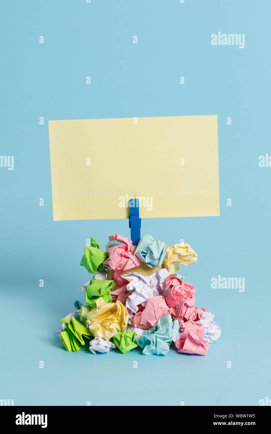 Reminder pile colored crumpled paper clothespin reminder blue ...