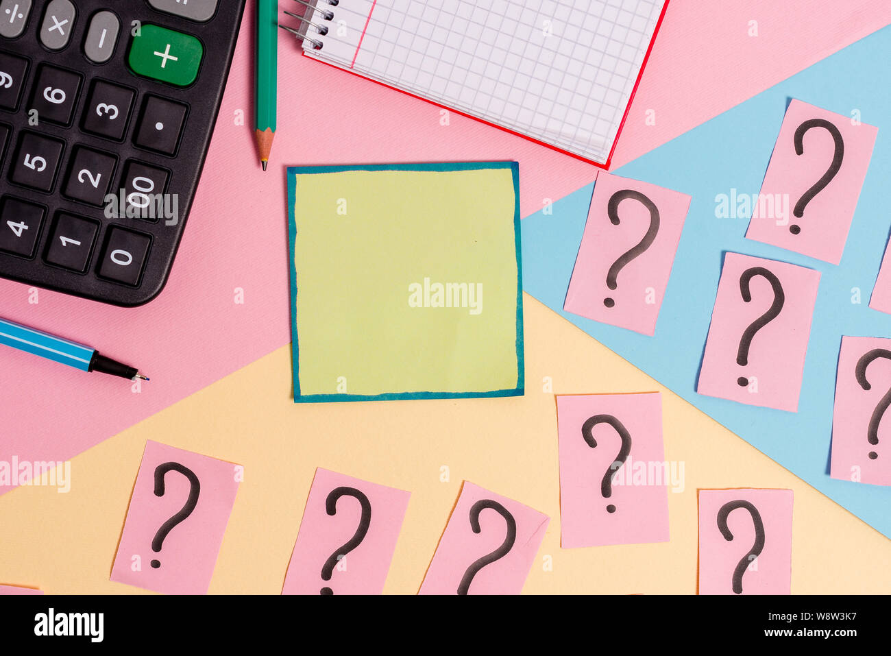 Mathematics stuff and writing equipment above pastel colours background ...